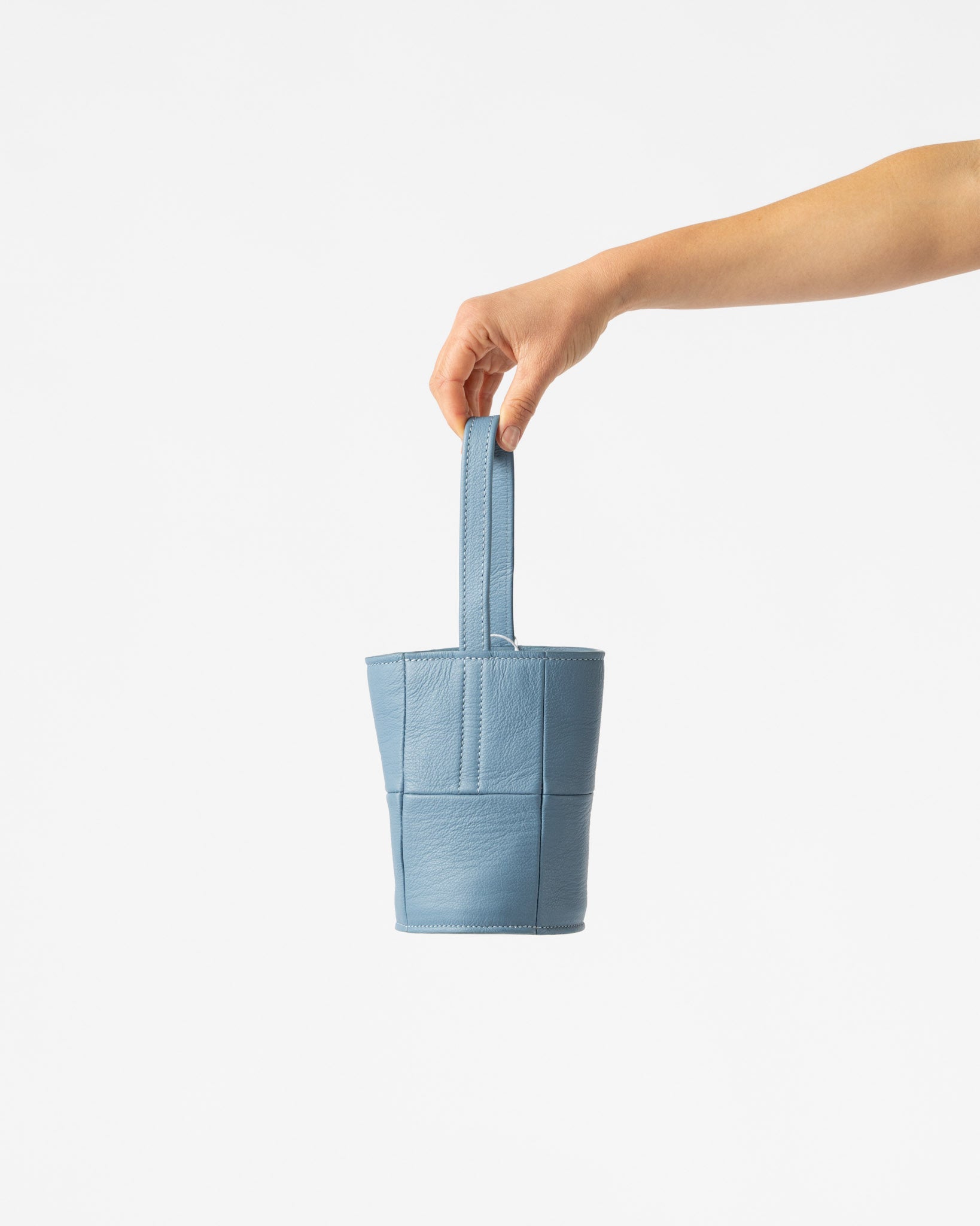 Cawley Mini Patchwork Leather Bucket Bag in Blue Curated at Jake and Jones